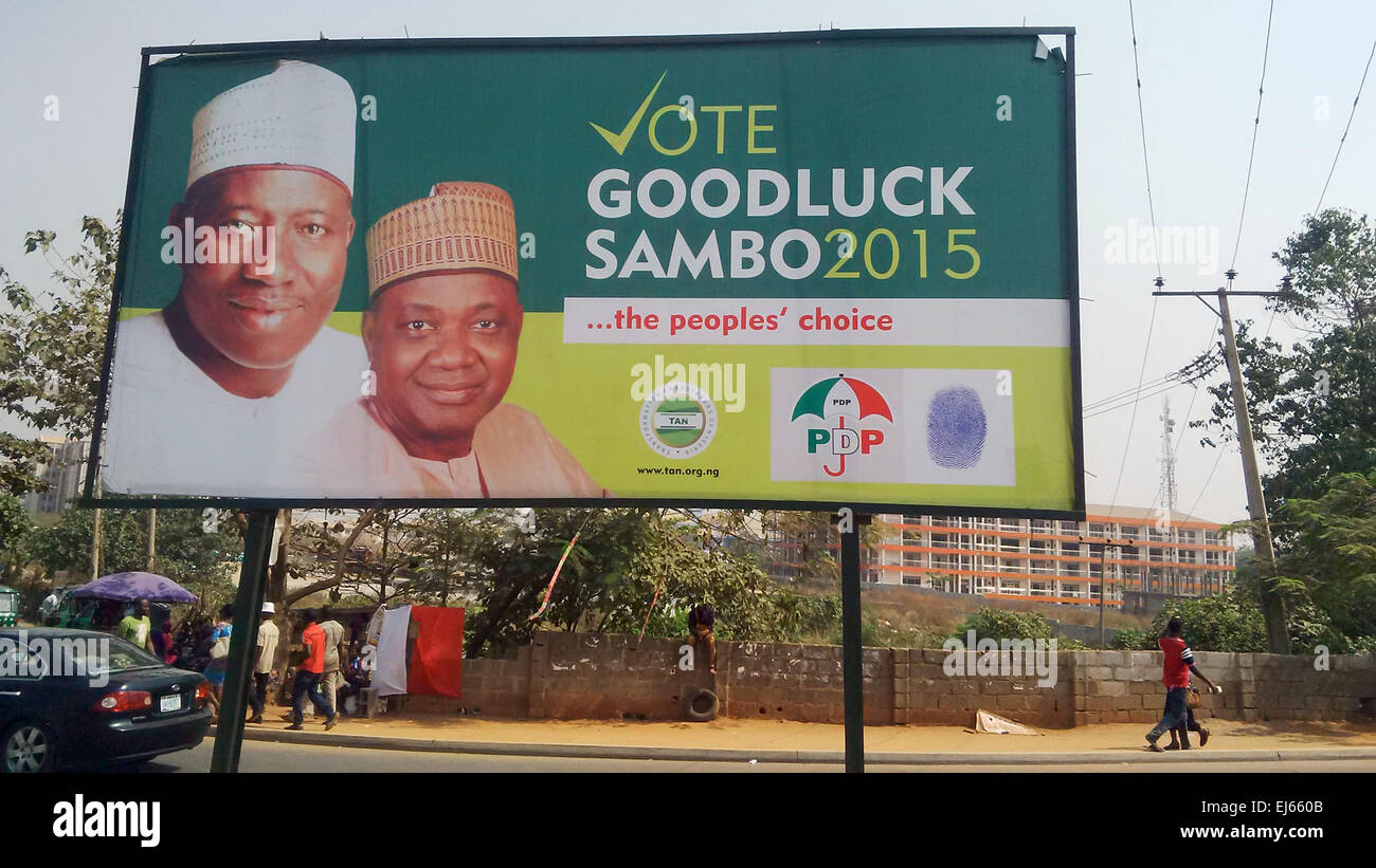 An election poster promotes President Goodluck Jonathan and his running ...