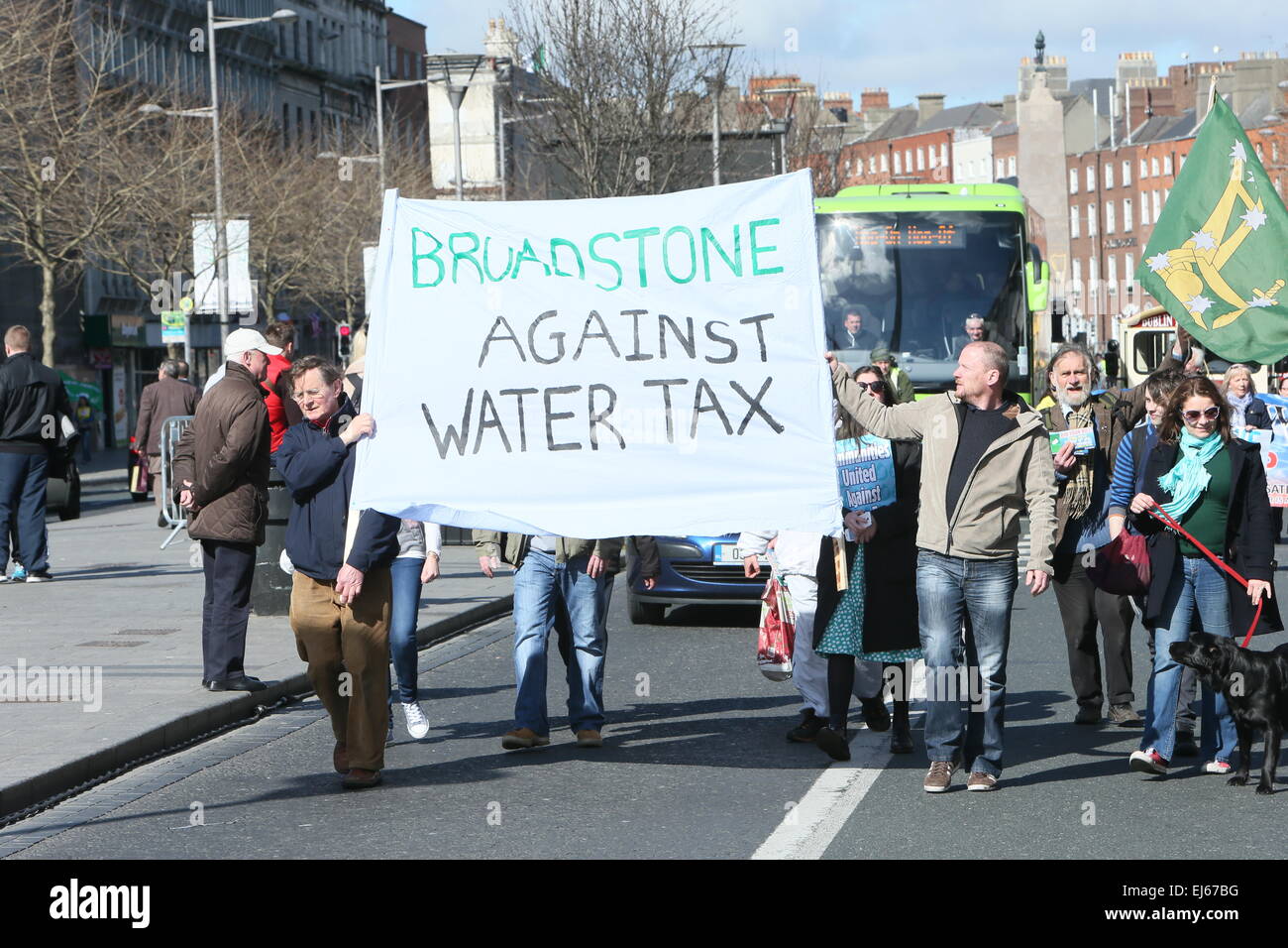 A group carries a protest sign. Image from the anti-water charges ...