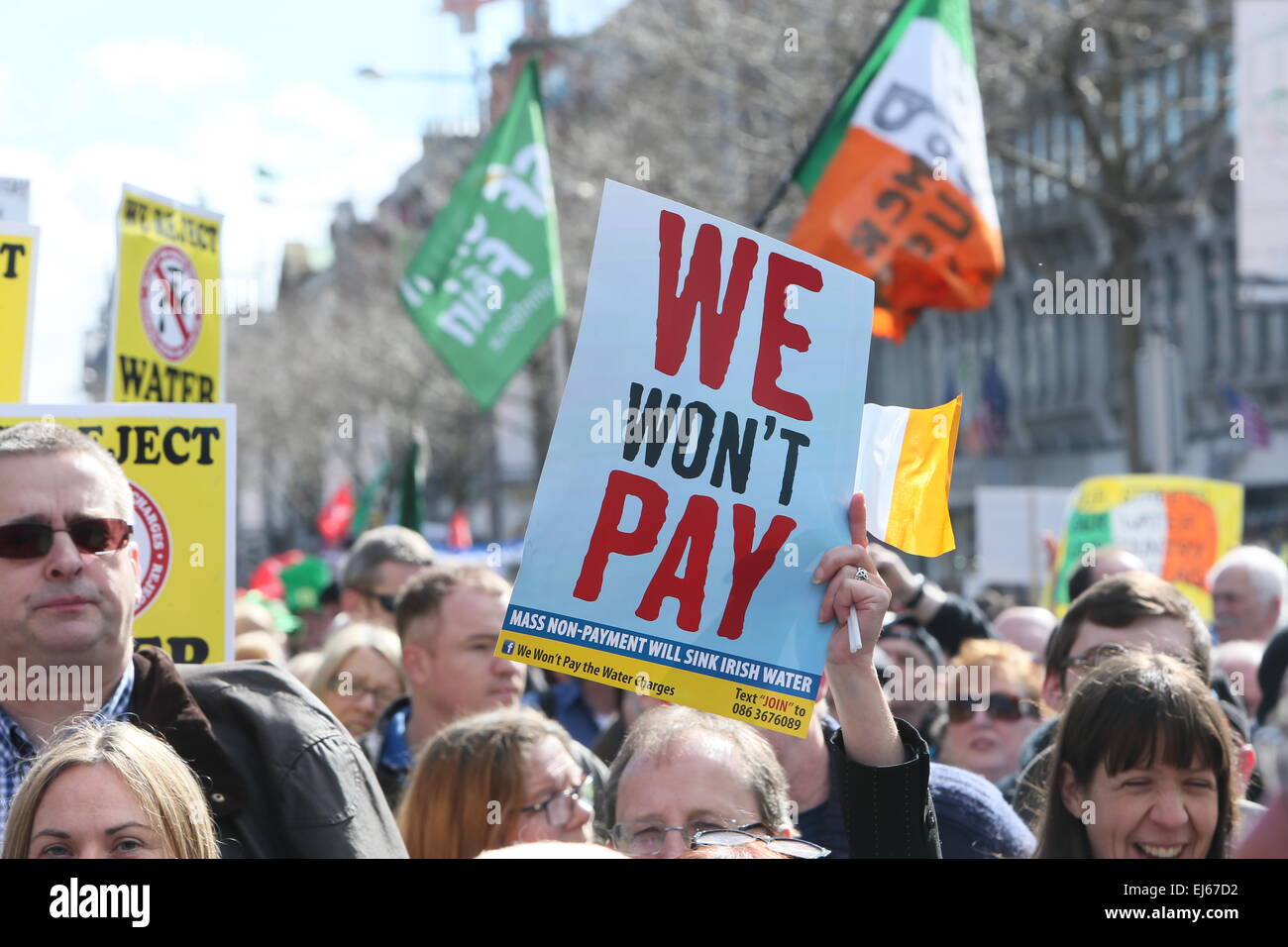 A 'We Won't Pay' poster is held up above the crowd. Image from the anti ...