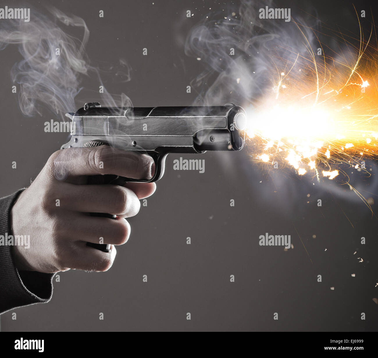 Killer with gun close-up on dark background Stock Photo - Alamy