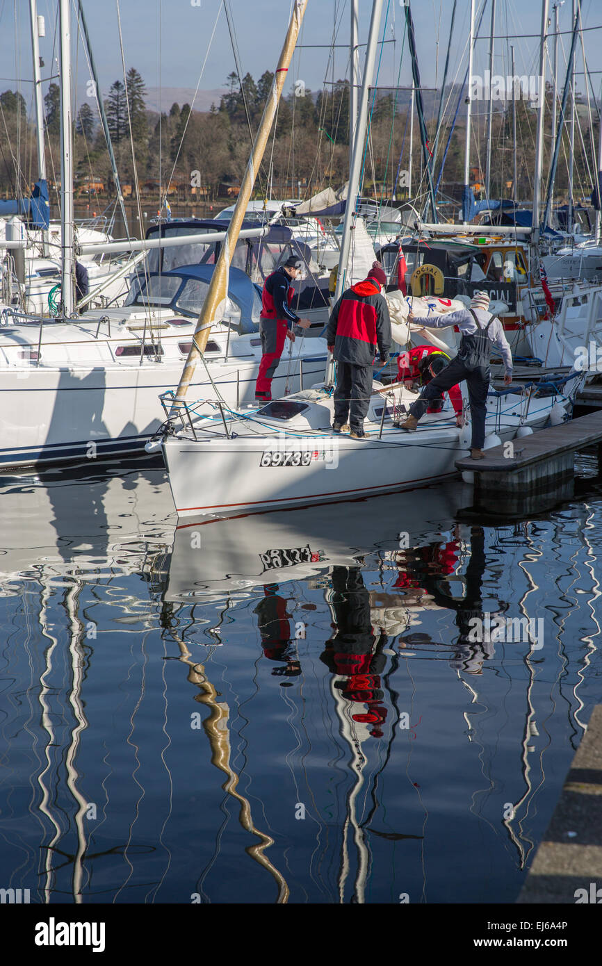 The crew of a yacht preparing the boat for sailing Stock Photo - Alamy