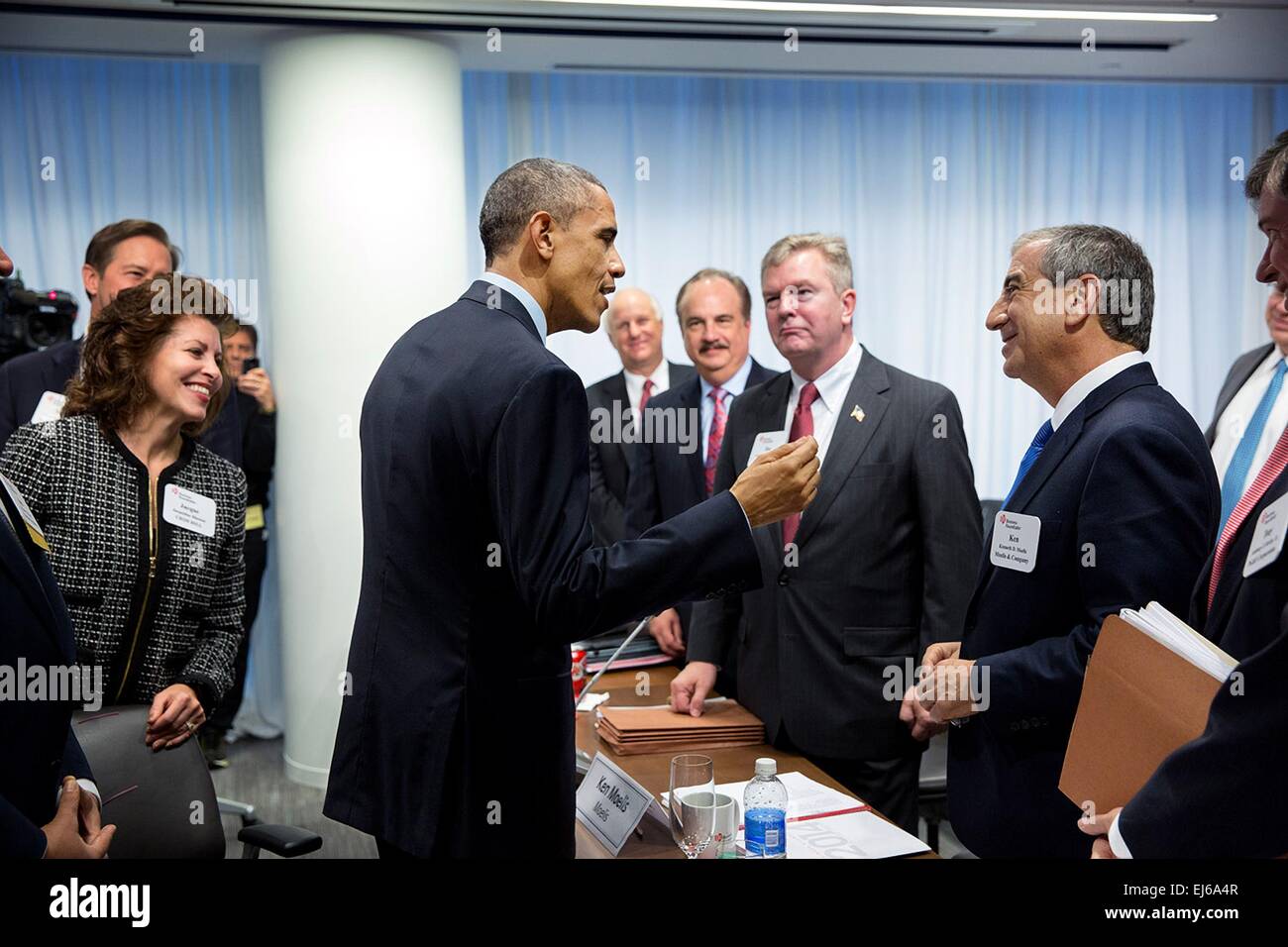 US President Barack Obama talks with participants during the quarterly ...