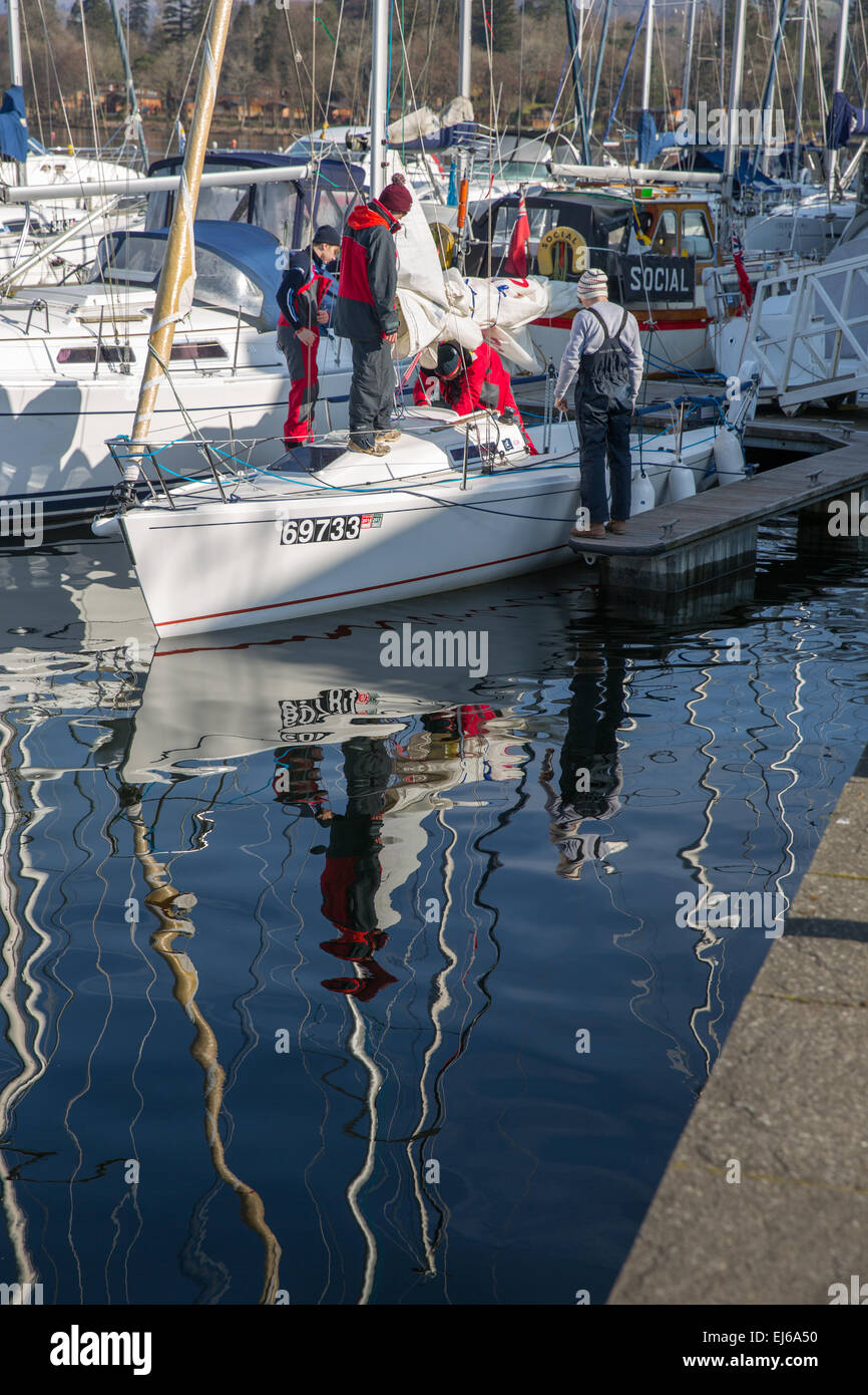 The crew of a yacht preparing the boat for sailing Stock Photo - Alamy