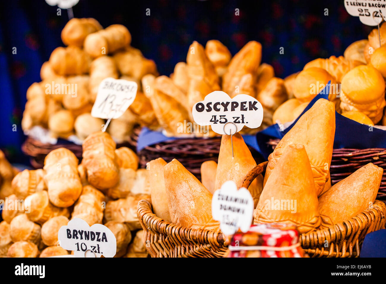 Traditional polish smoked cheese oscypek on outdoor market in Krakow ...