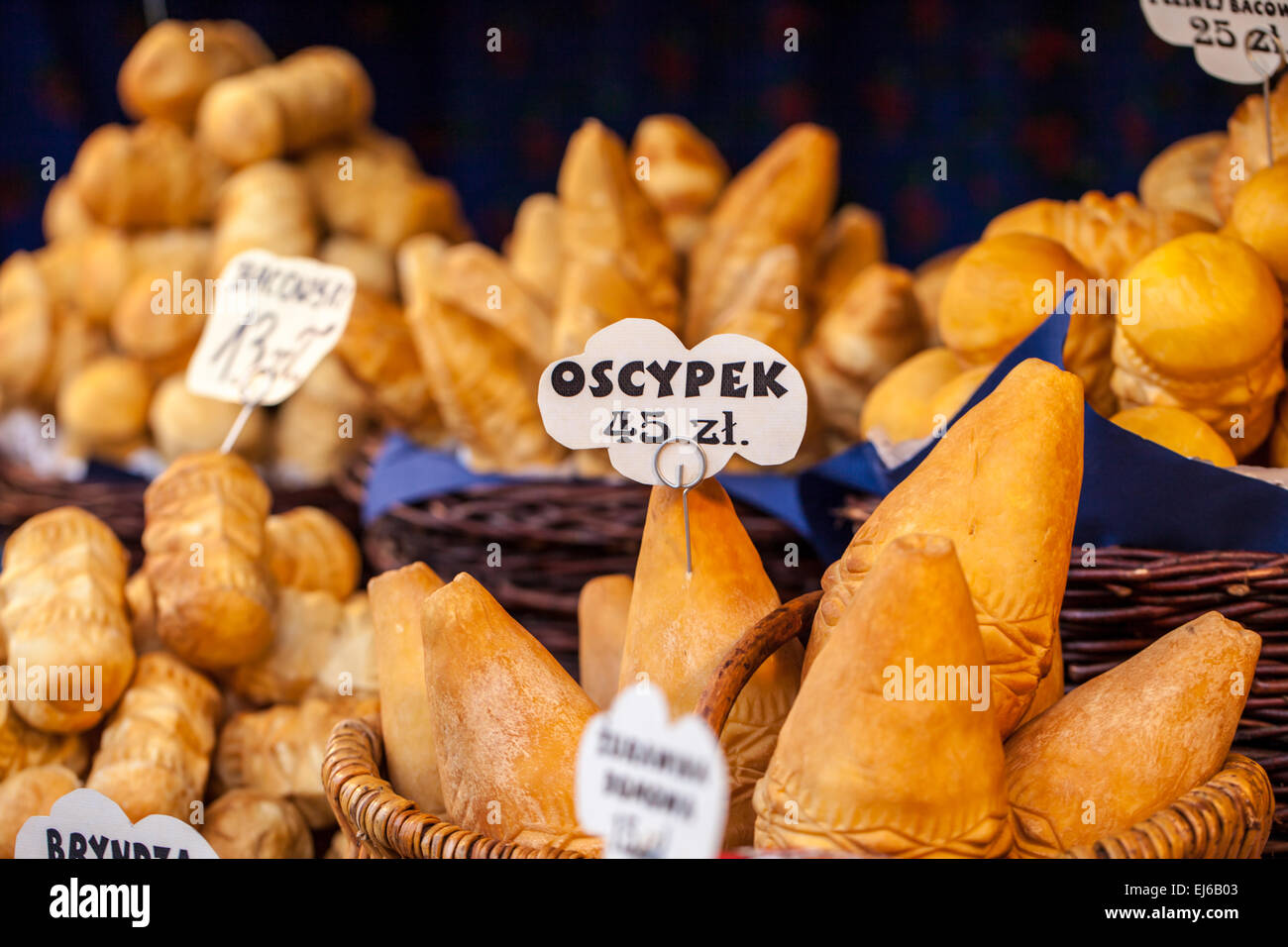 Traditional polish smoked cheese oscypek on outdoor market in Krakow ...