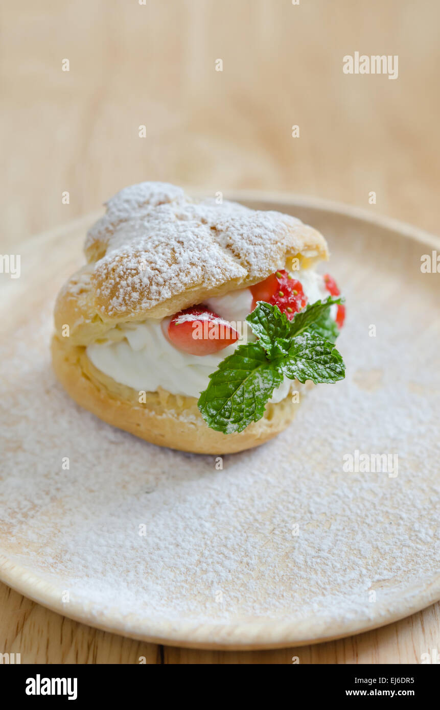 fresh strawberry Choux Cream on wooden dish Stock Photo - Alamy