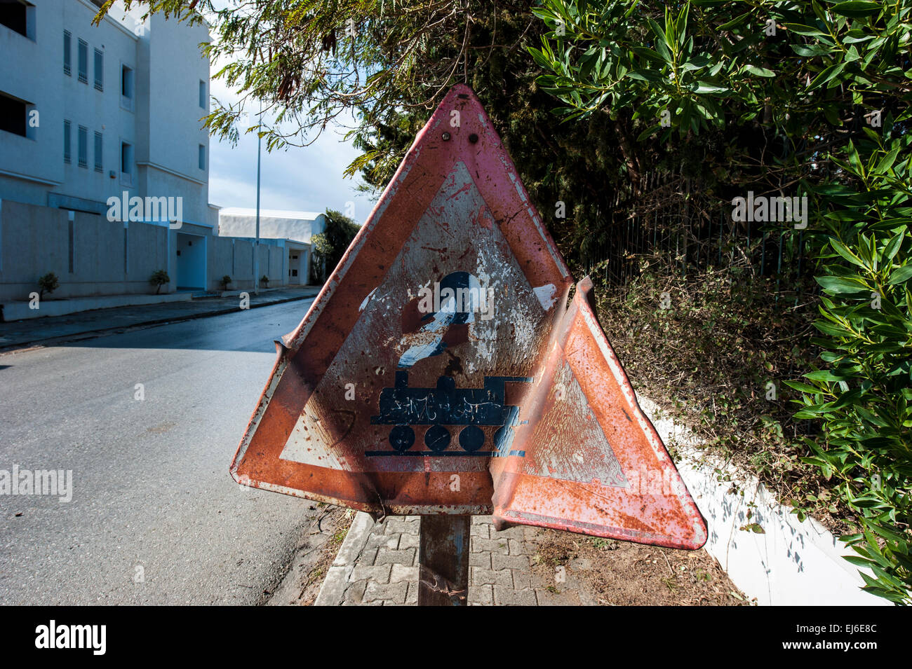 A destroyed warning sign for level crossings near the town of Hammamet ...