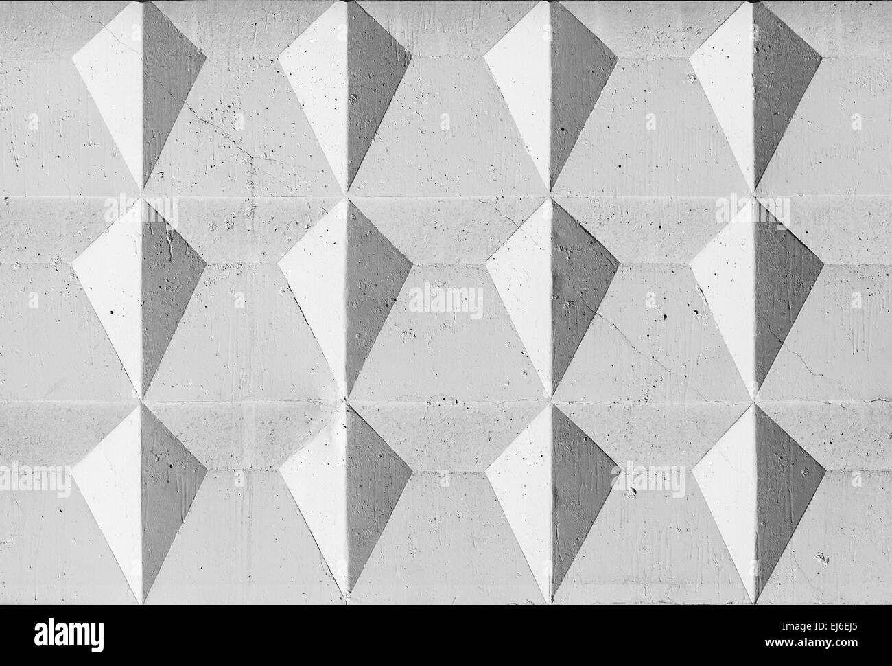Background texture of old gray concrete fence with square relief ...