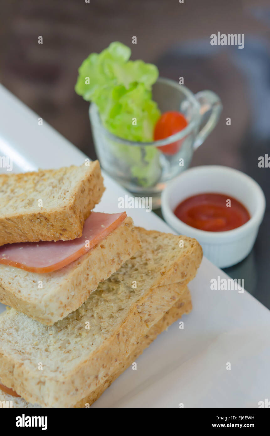 close up toasted sandwich with ham and cheese on dish Stock Photo - Alamy