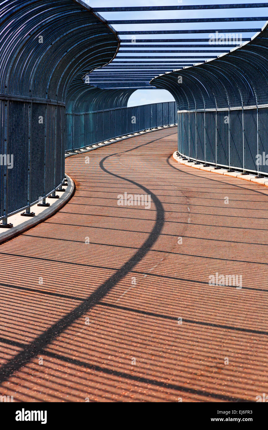 Metal covered walkway with strong shadows from sunlight, Glasgow ...
