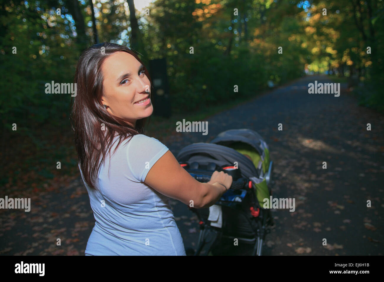 Woman kid stroller hi-res stock photography and images - Alamy