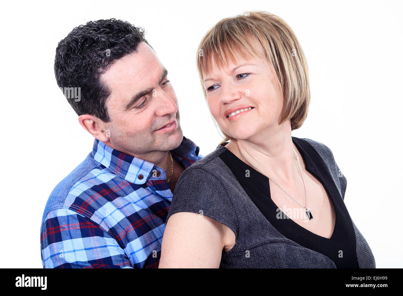 Studio portrait of happy seniors couple hugging. Isolated on whi Stock ...