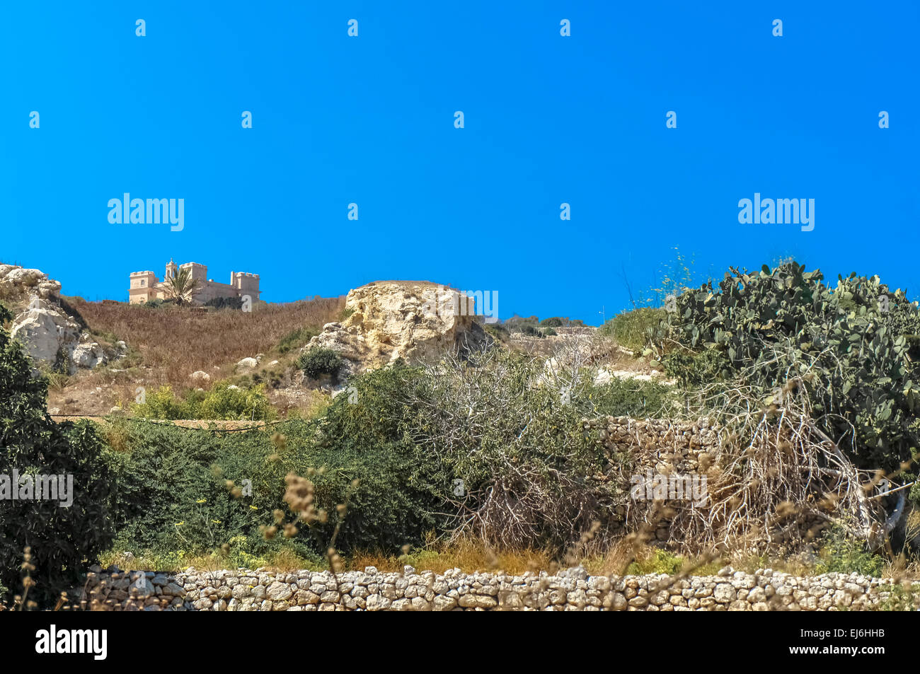 Maltese countryside view with old Red Tower in the background ...