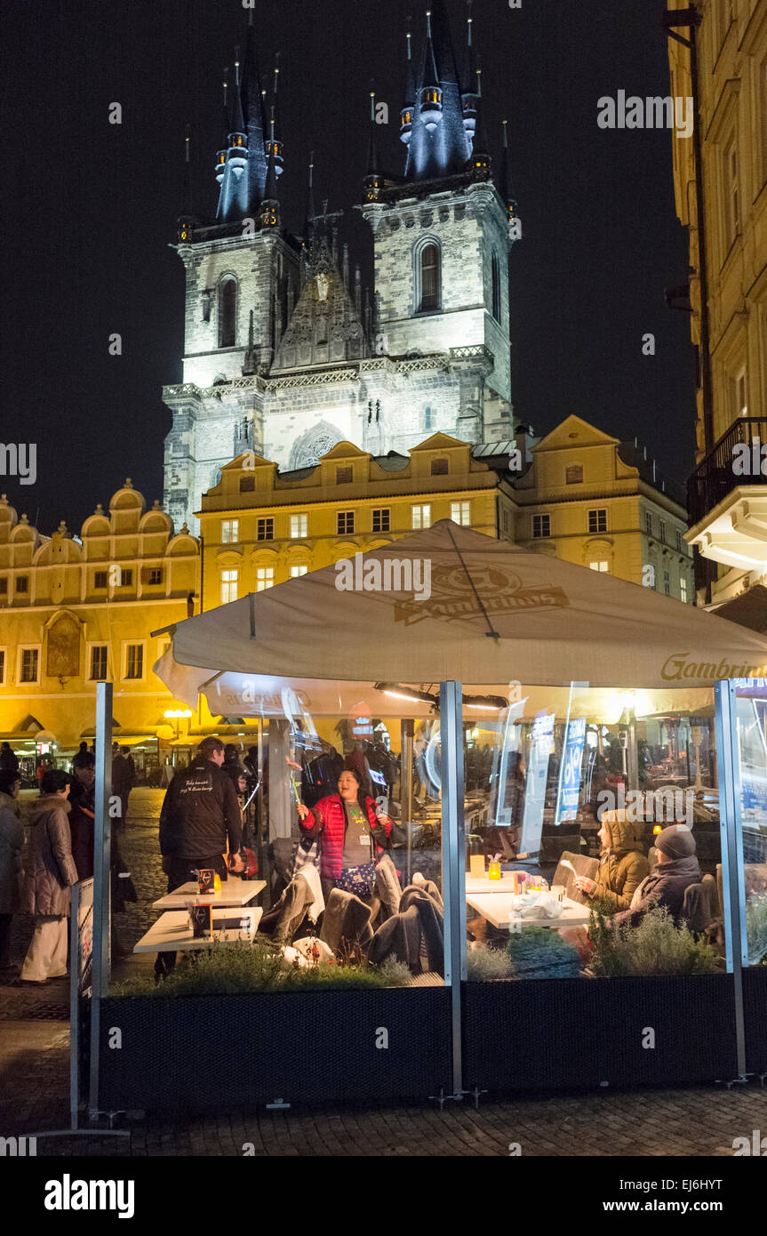 Terrace cafe at the Old Town square at night in Prague, Czech Republic ...