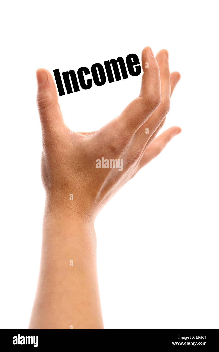 Vertical shot of a hand holding the word "Income" between two fingers ...