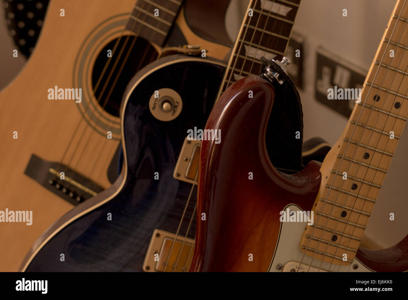 Guitar lined up staked electric base Stock Photo - Alamy