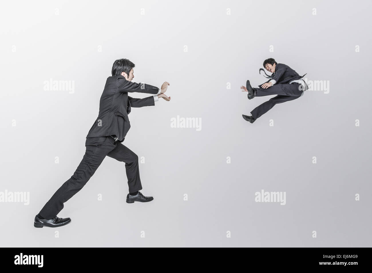 Japanese businessmen fighting extremely Stock Photo - Alamy