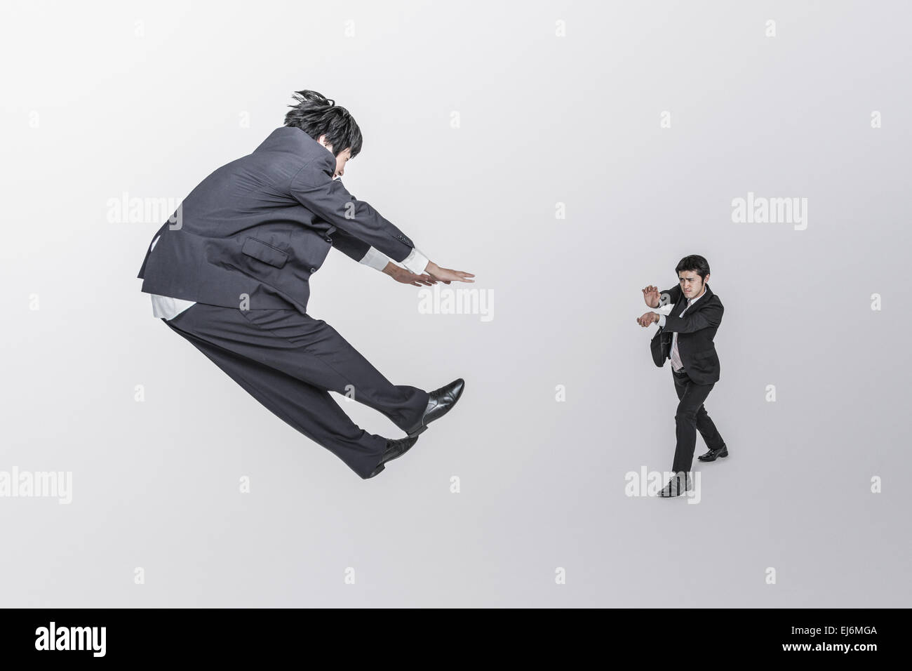 Japanese businessmen fighting extremely Stock Photo - Alamy