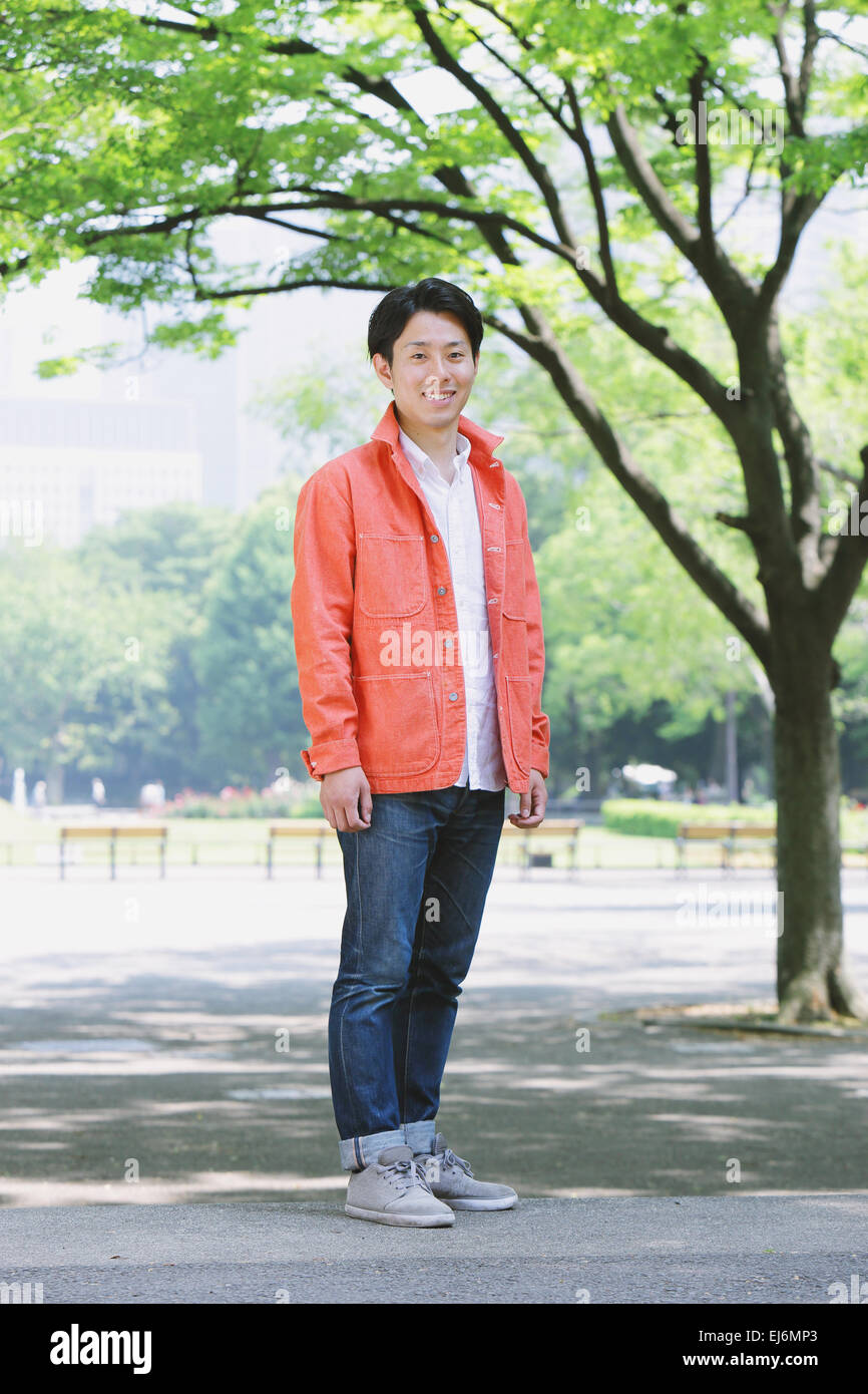 Young smiling Japanese man in a park Stock Photo - Alamy