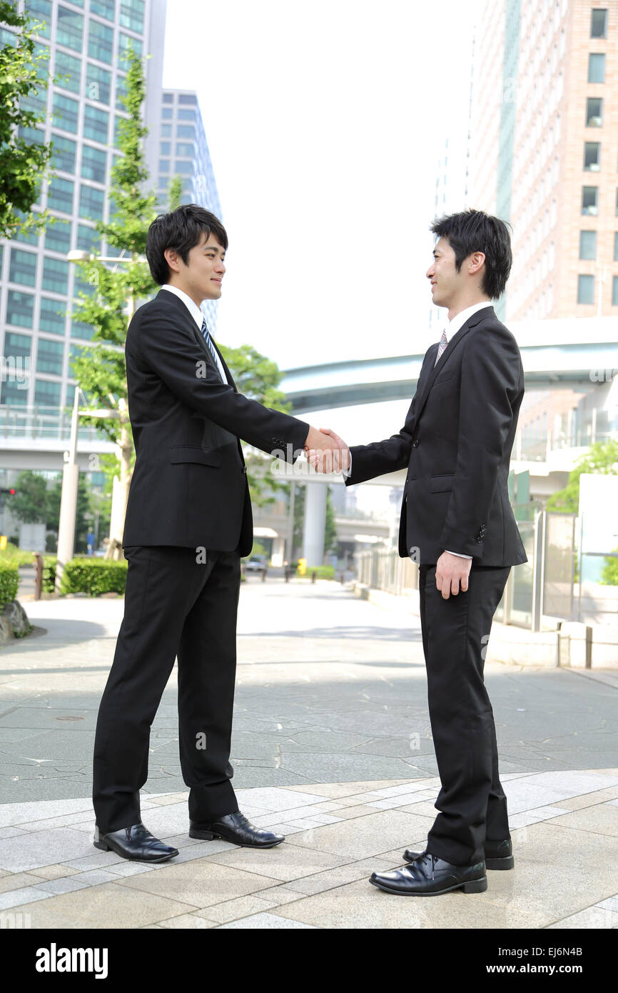 Japanese businessmen shaking hands Stock Photo - Alamy