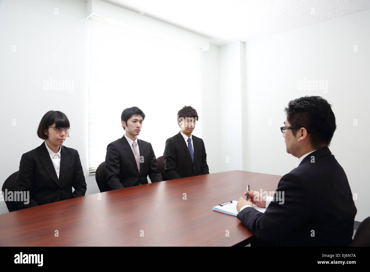 Young Japanese business people work examination Stock Photo - Alamy