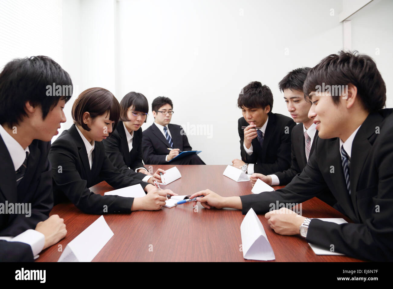 Young Japanese business people work examination Stock Photo - Alamy