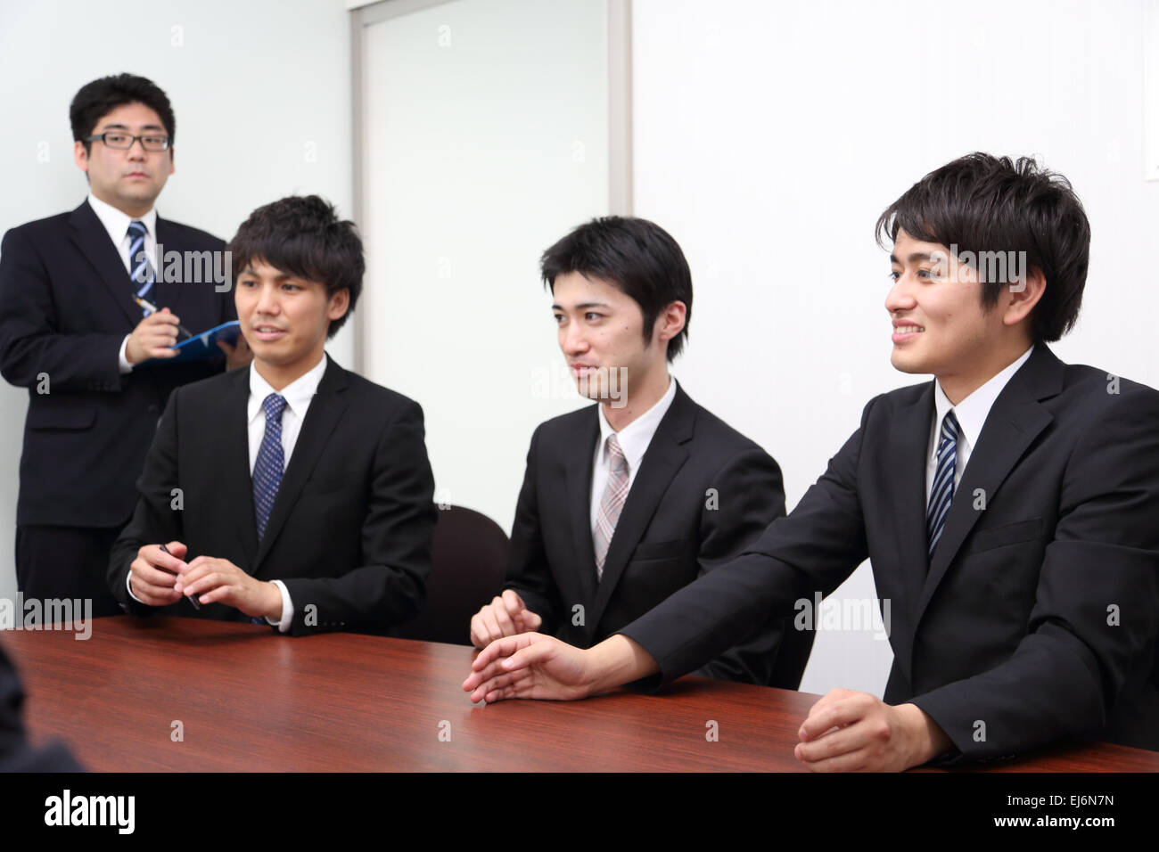 Young Japanese business people work examination Stock Photo - Alamy