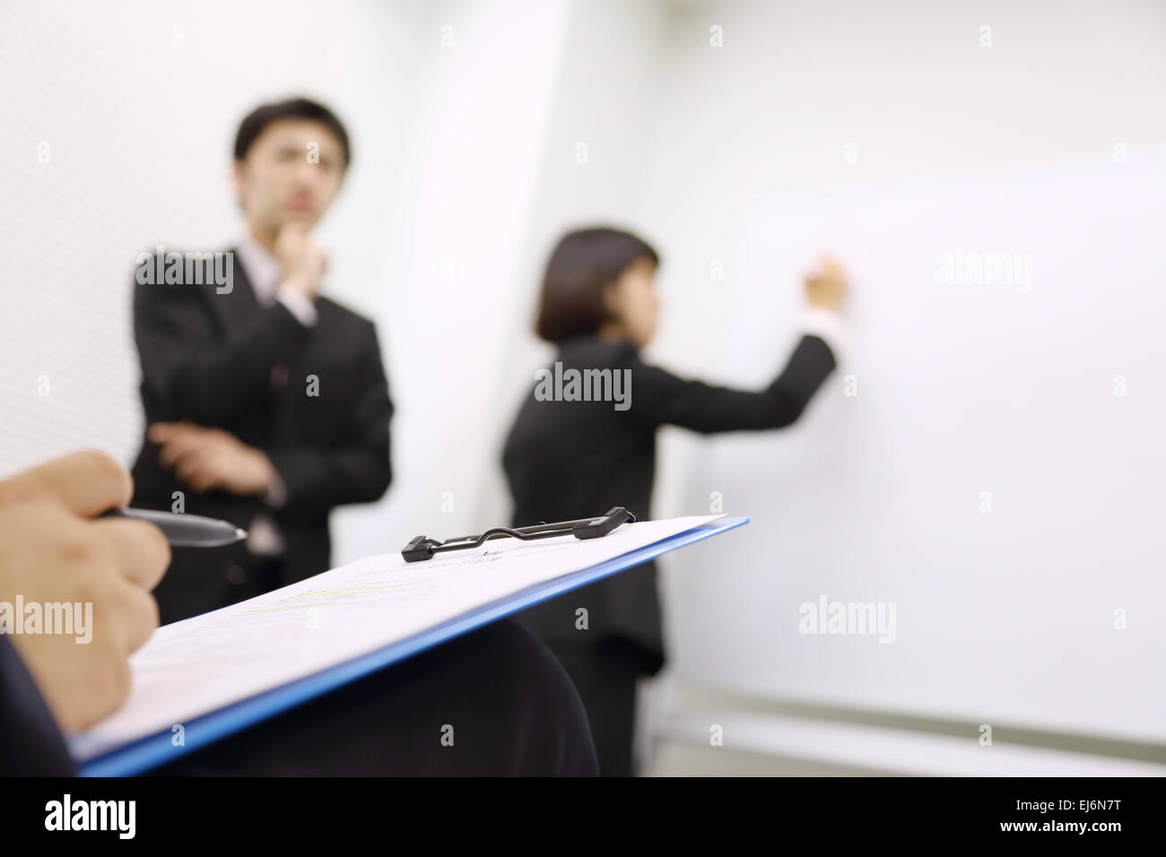 Young Japanese business people work examination Stock Photo - Alamy