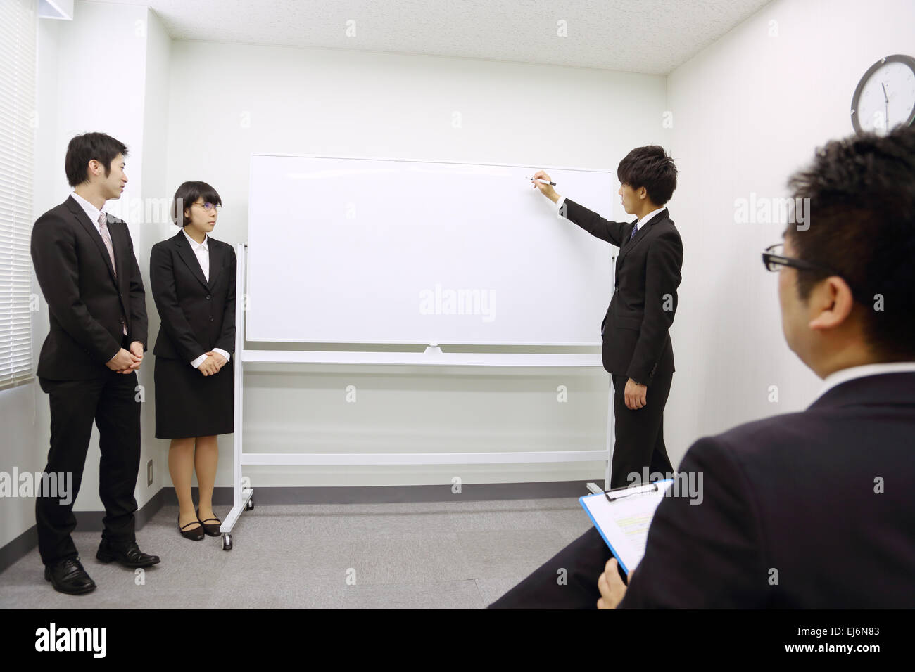 Young Japanese business people work examination Stock Photo - Alamy