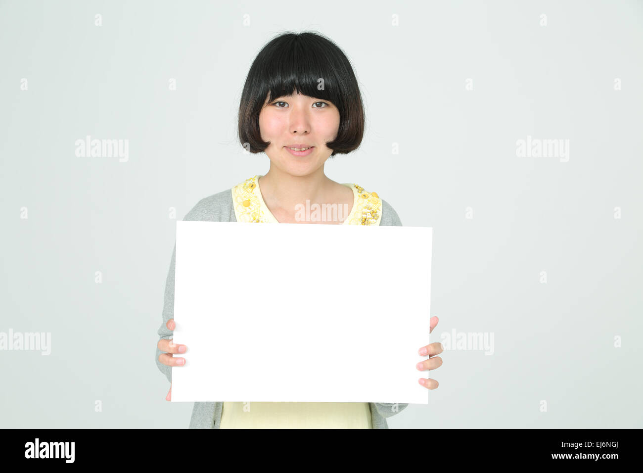 Girl holding blank board hi-res stock photography and images - Alamy