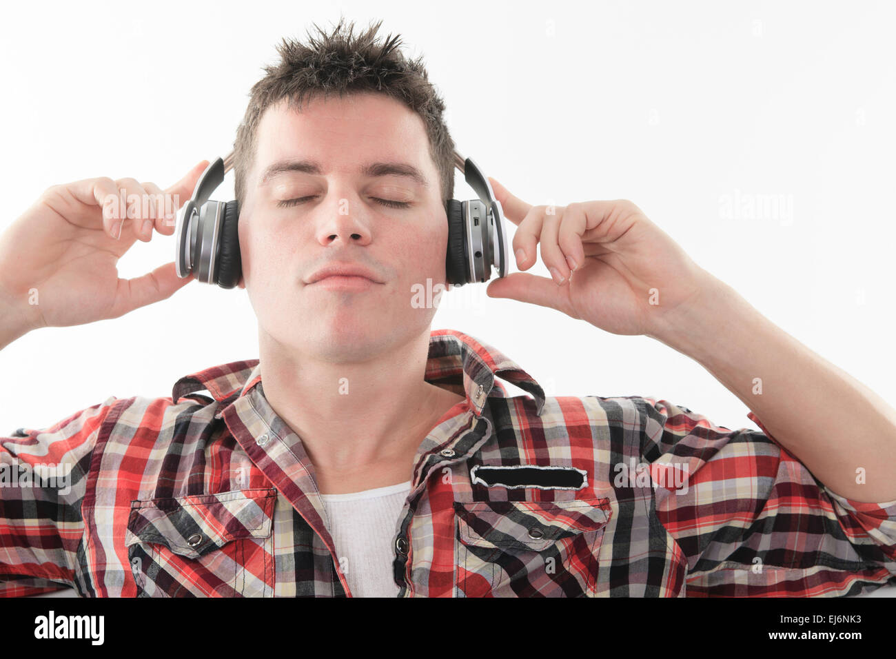 Handsome guy enjoying music on headphones Stock Photo - Alamy