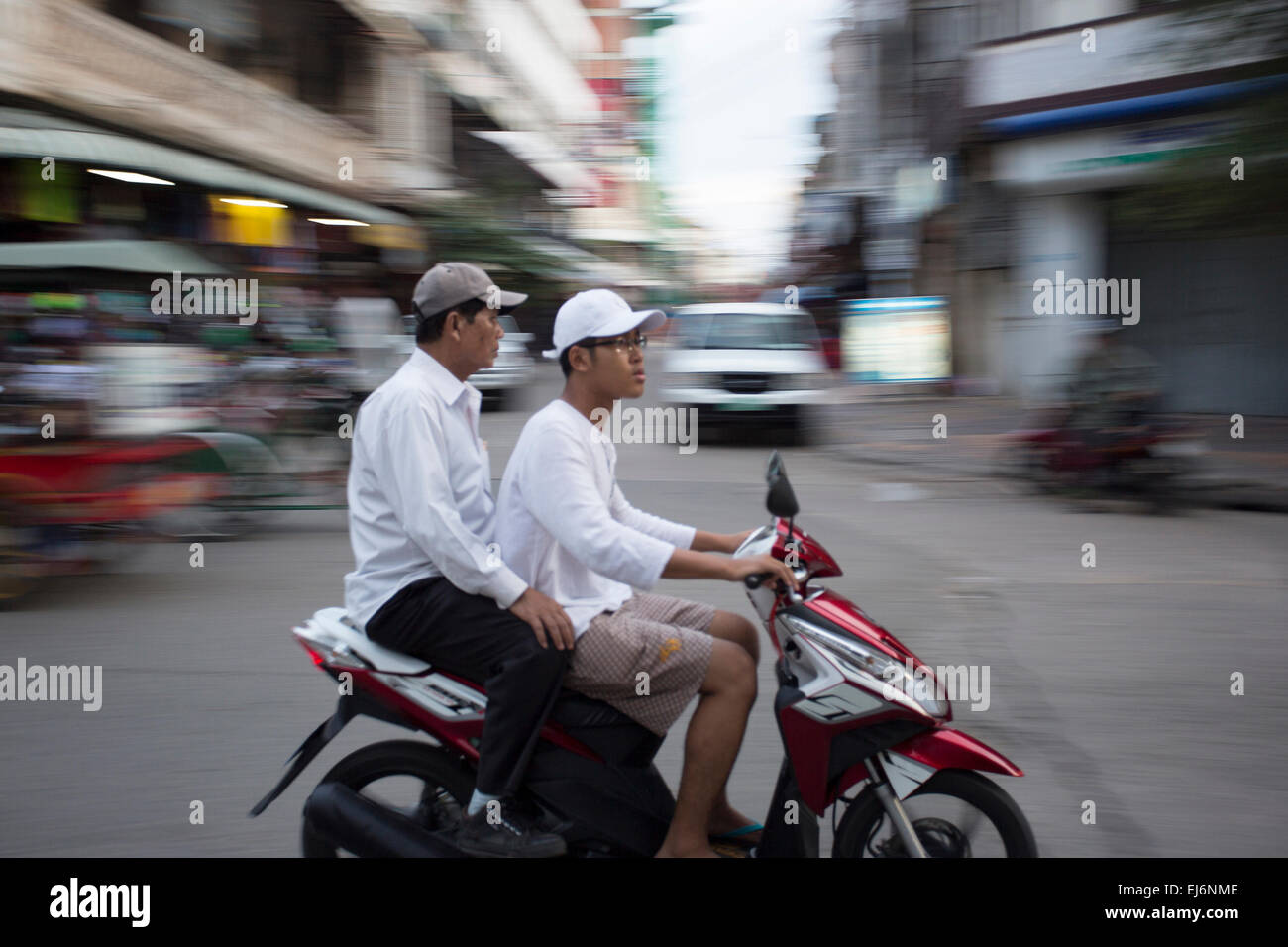 Two men on moped riding hi-res stock photography and images - Alamy