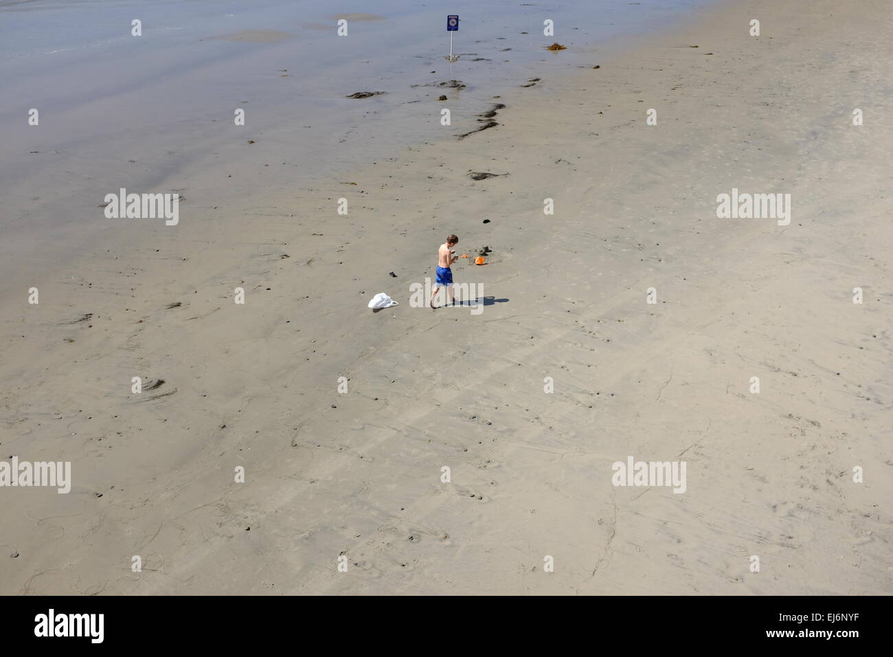 Beach access in Solana Beach, CA with concrete stairs to the sand, boy ...