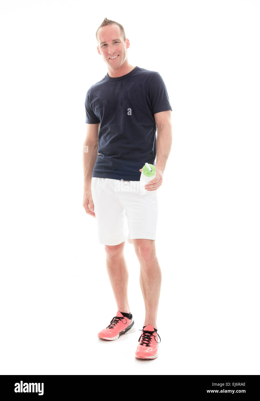 Portrait Of Young Man Jogging On White Background Stock Photo - Alamy