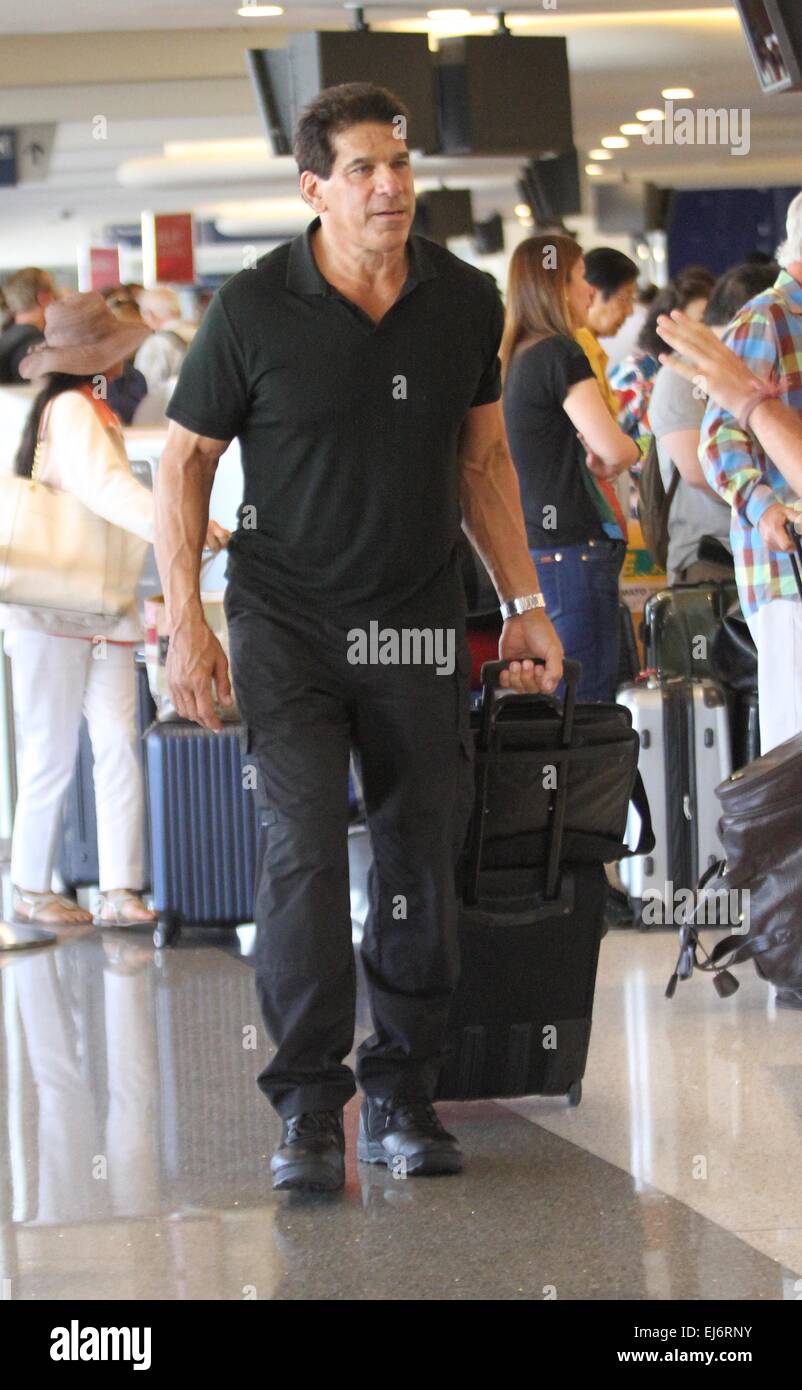 Lou Ferrigno shows off his muscles at Los Angeles International Airport ...