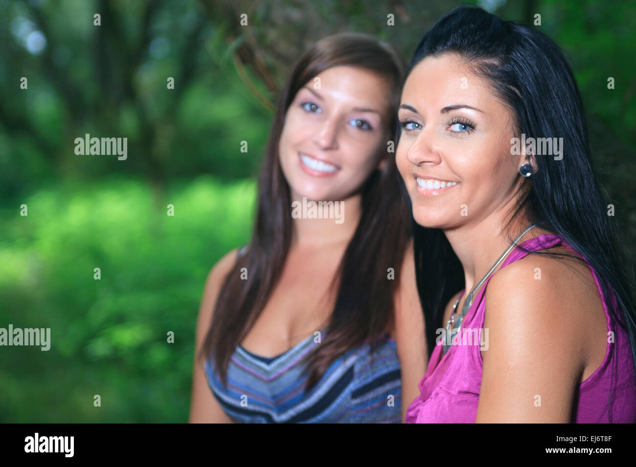 friend portrait over a green nature background Stock Photo - Alamy
