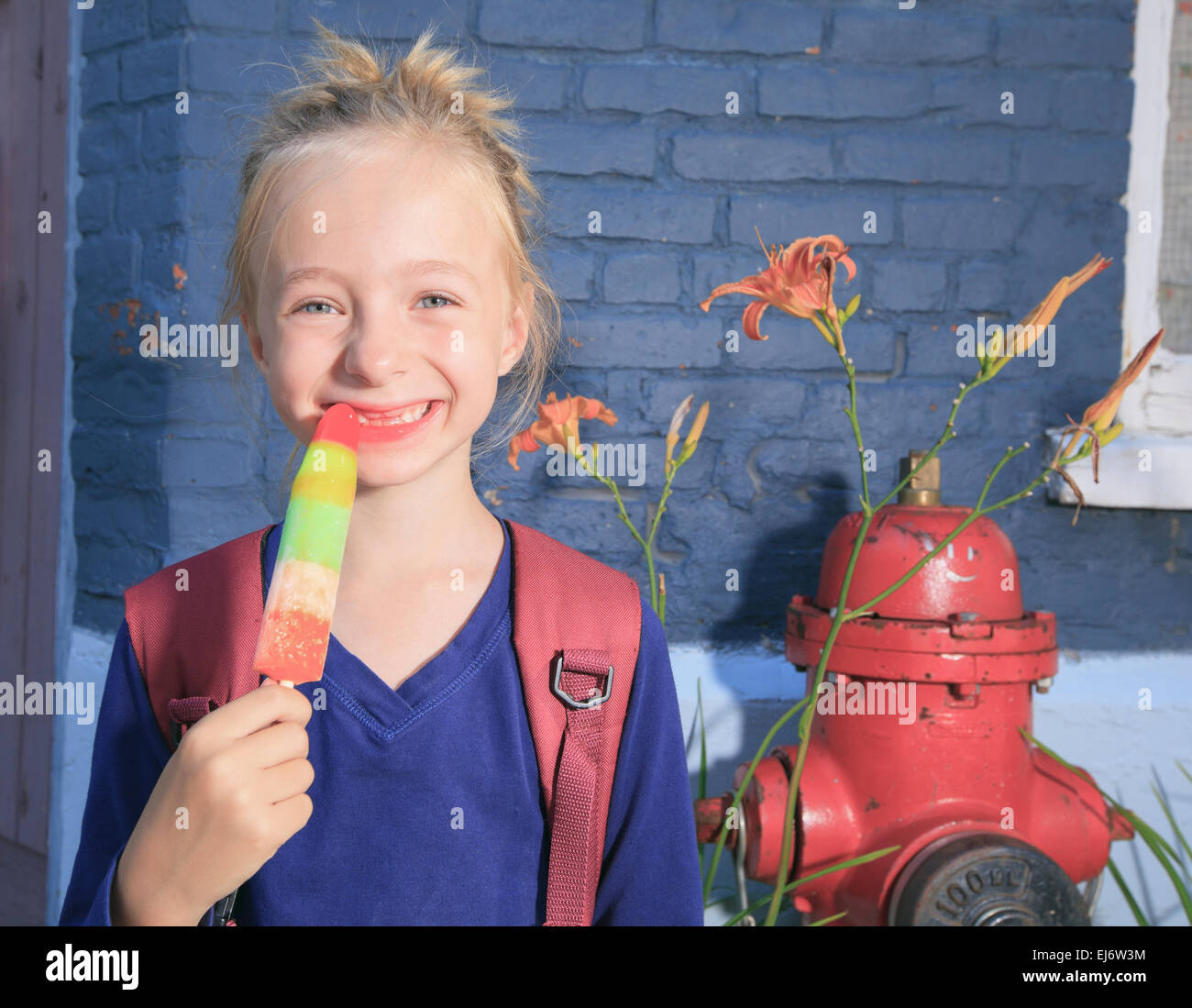 A Happy little girl outside Stock Photo - Alamy