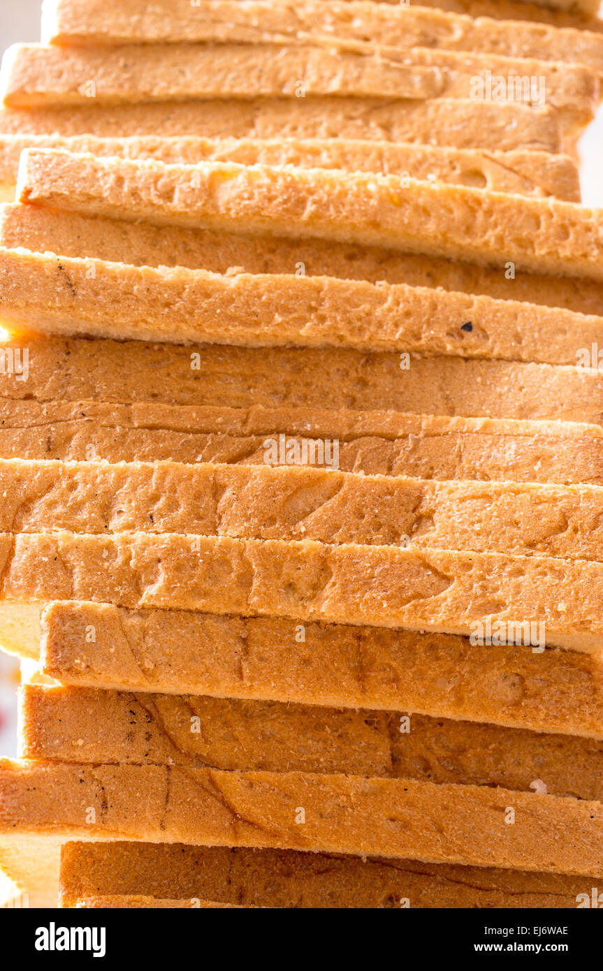 Toast bread slices to a lot of background Stock Photo - Alamy
