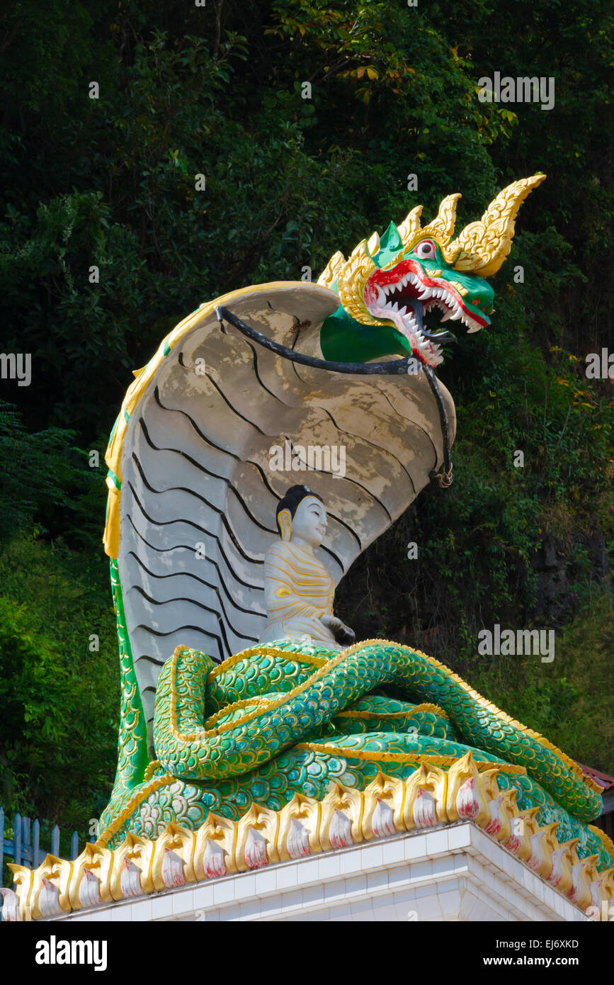 Statue of Buddha meditating with naga (serpent king), Pindaya Cave ...