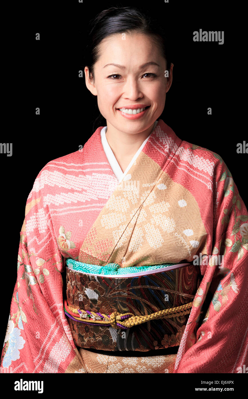 A Beautiful japanese kimono woman in black background Stock Photo - Alamy