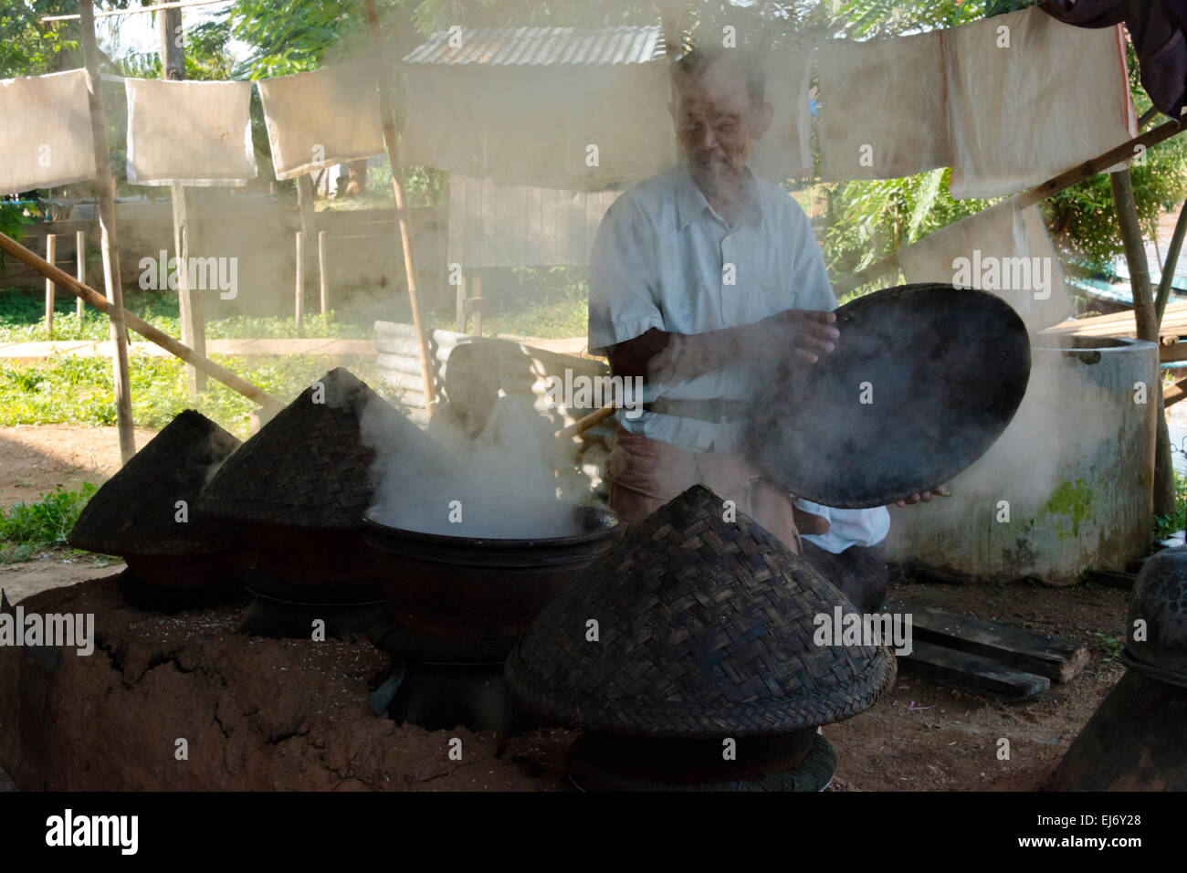 Cooking rice in bamboo woks, Inle Lake, Shan State, Myanmar Stock Photo ...