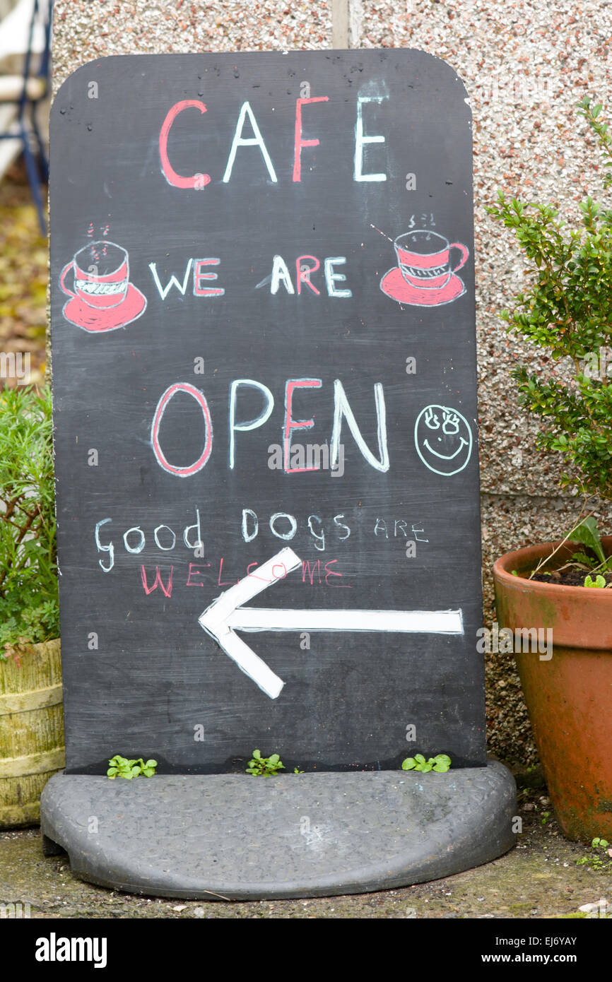 Cafe - we are open blackboard sign - good dogs welcome Stock Photo - Alamy
