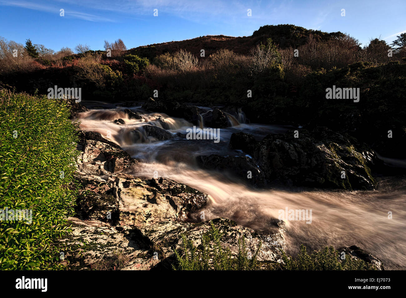 Water flowing over rocks in creek, County Donegal, Republic of Ireland ...