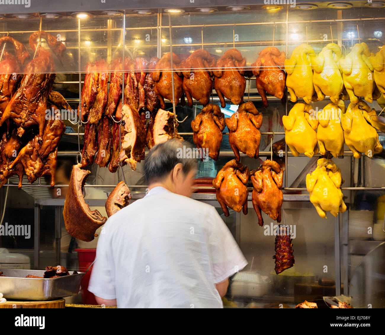 Roast cantonese ducks and another rosted meat in a windows display of a ...
