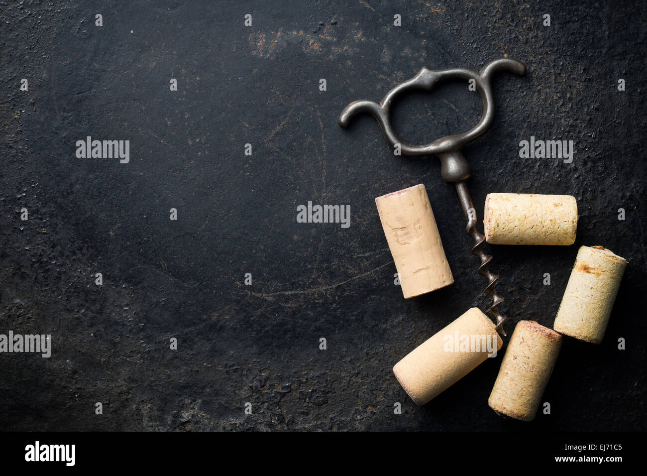 corkscrew and cork on black background Stock Photo - Alamy