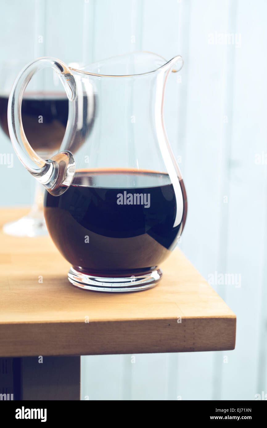 pitcher of red wine on kitchen table Stock Photo - Alamy