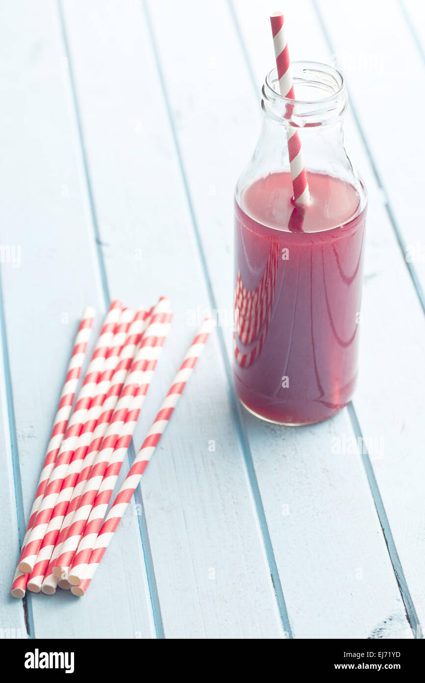 fruity juice in glass on kitchen table Stock Photo - Alamy