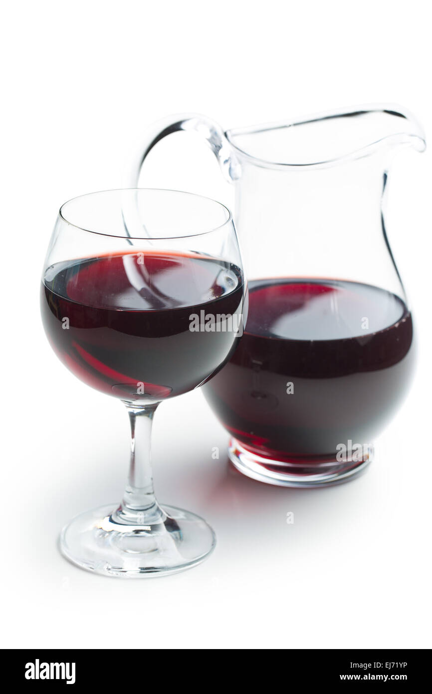 glass of red wine with pitcher on white background Stock Photo - Alamy