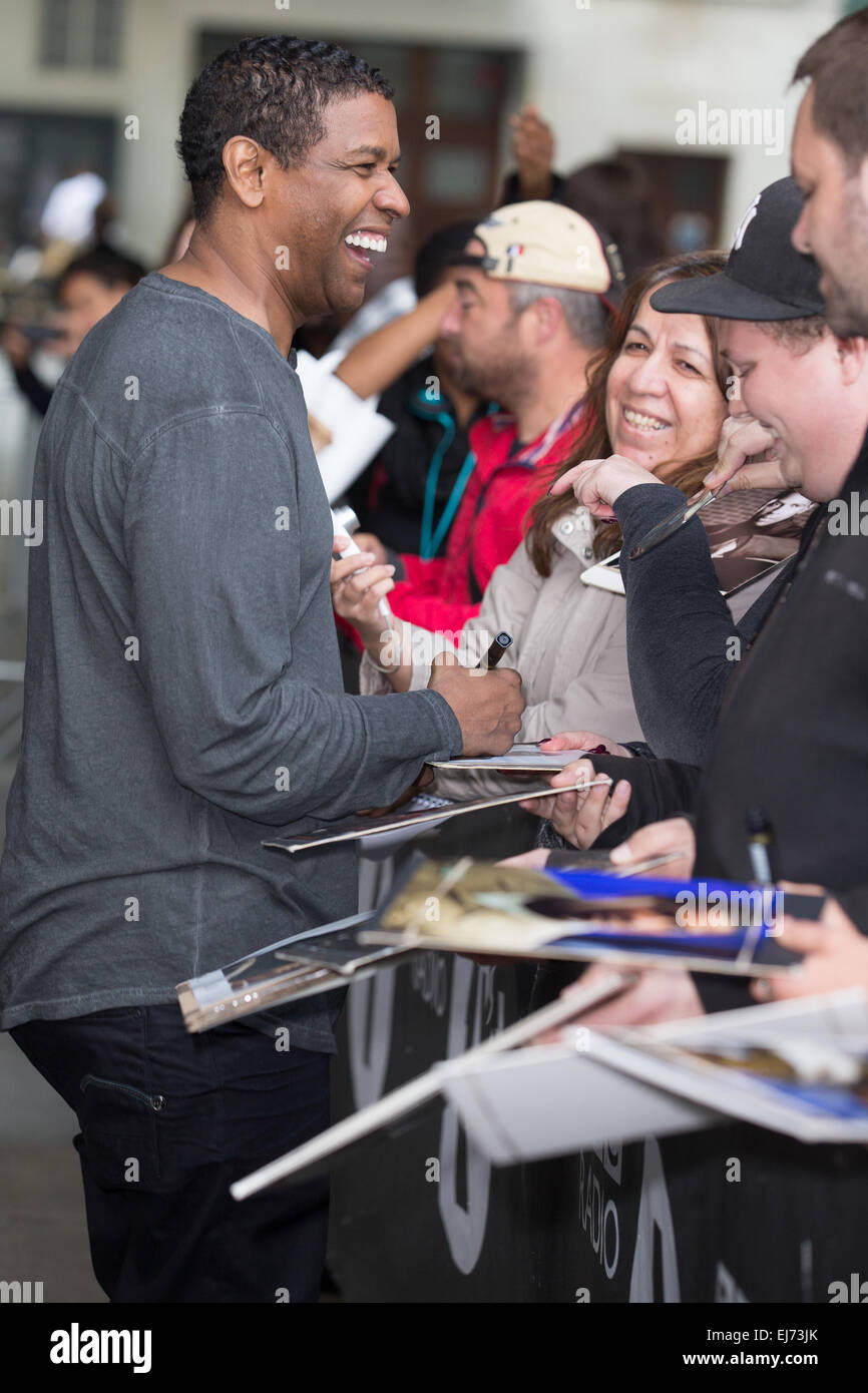 Denzel Washington signing autographs for fans outside the BBC Radio 1 ...