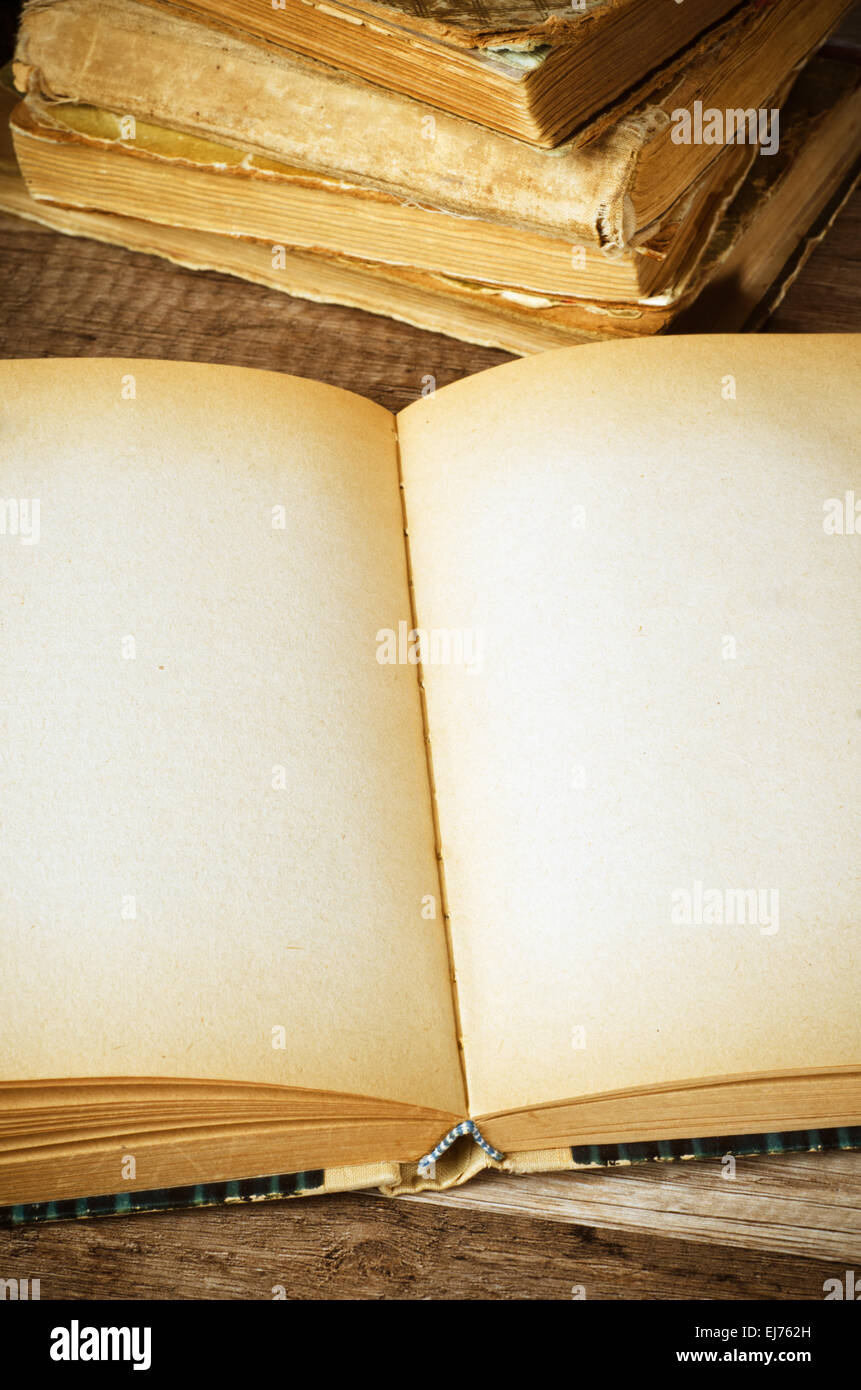 open old book on a wooden surface Stock Photo - Alamy